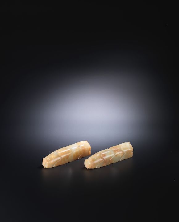 Bonhams : A pair of pale brownish-green jade carvings of pigs Han ...