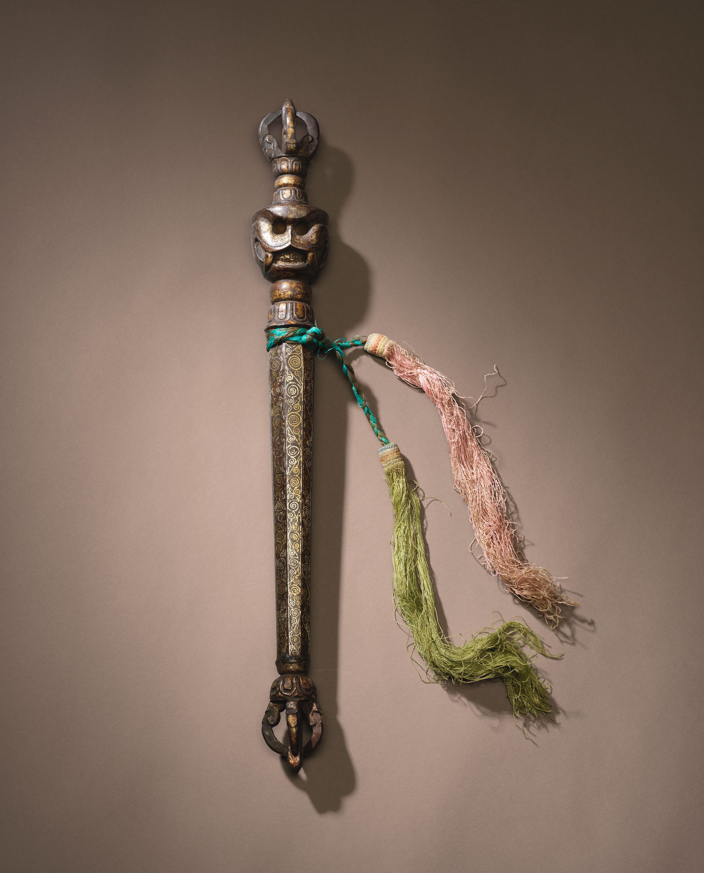 Bonhams : A GOLD AND SILVER INLAID IRON DANDA TIBET, 15TH CENTURY