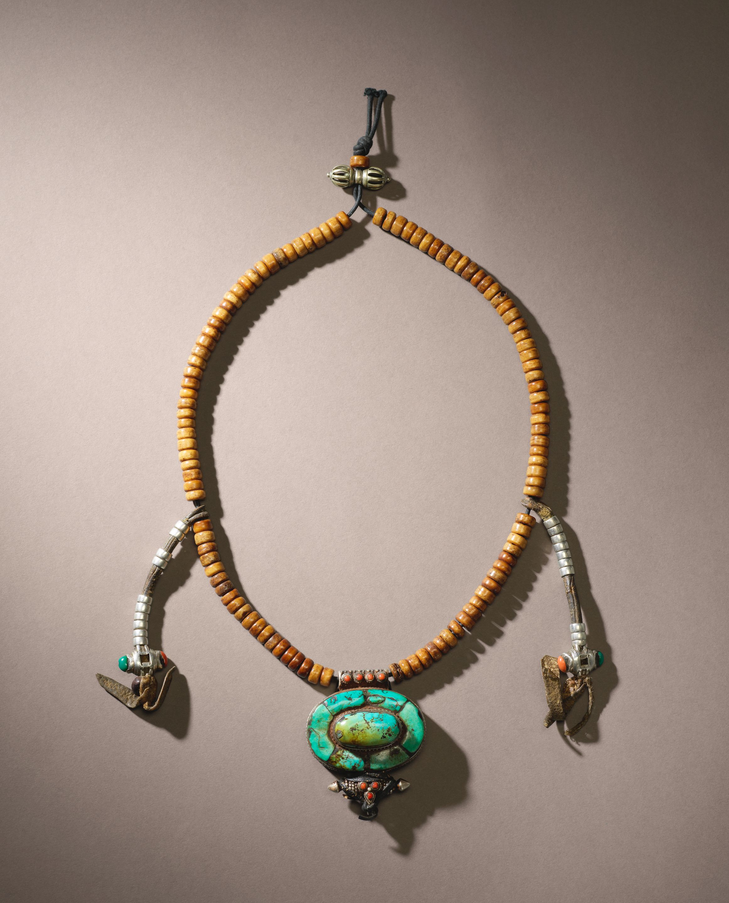 Bonhams : A BONE MALA WITH TURQUOISE INLAID SILVER GAU