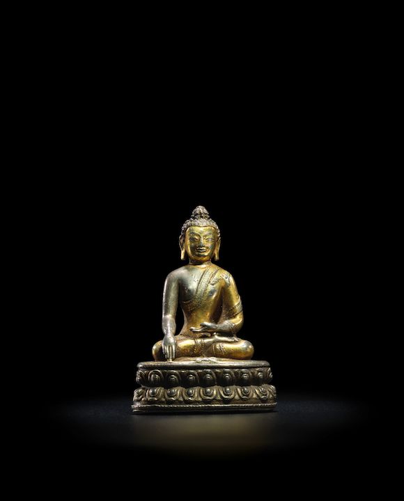 Bonhams : A PARCEL GILT SILVER FIGURE OF BUDDHA KHASA MALLA, CIRCA 14TH ...
