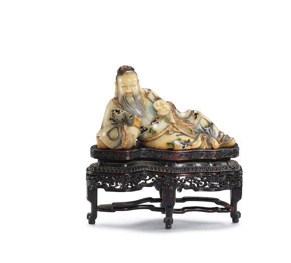 Bonhams : A polychrome soapstone 'Li Bai' brush rest 17th/18th century (3)