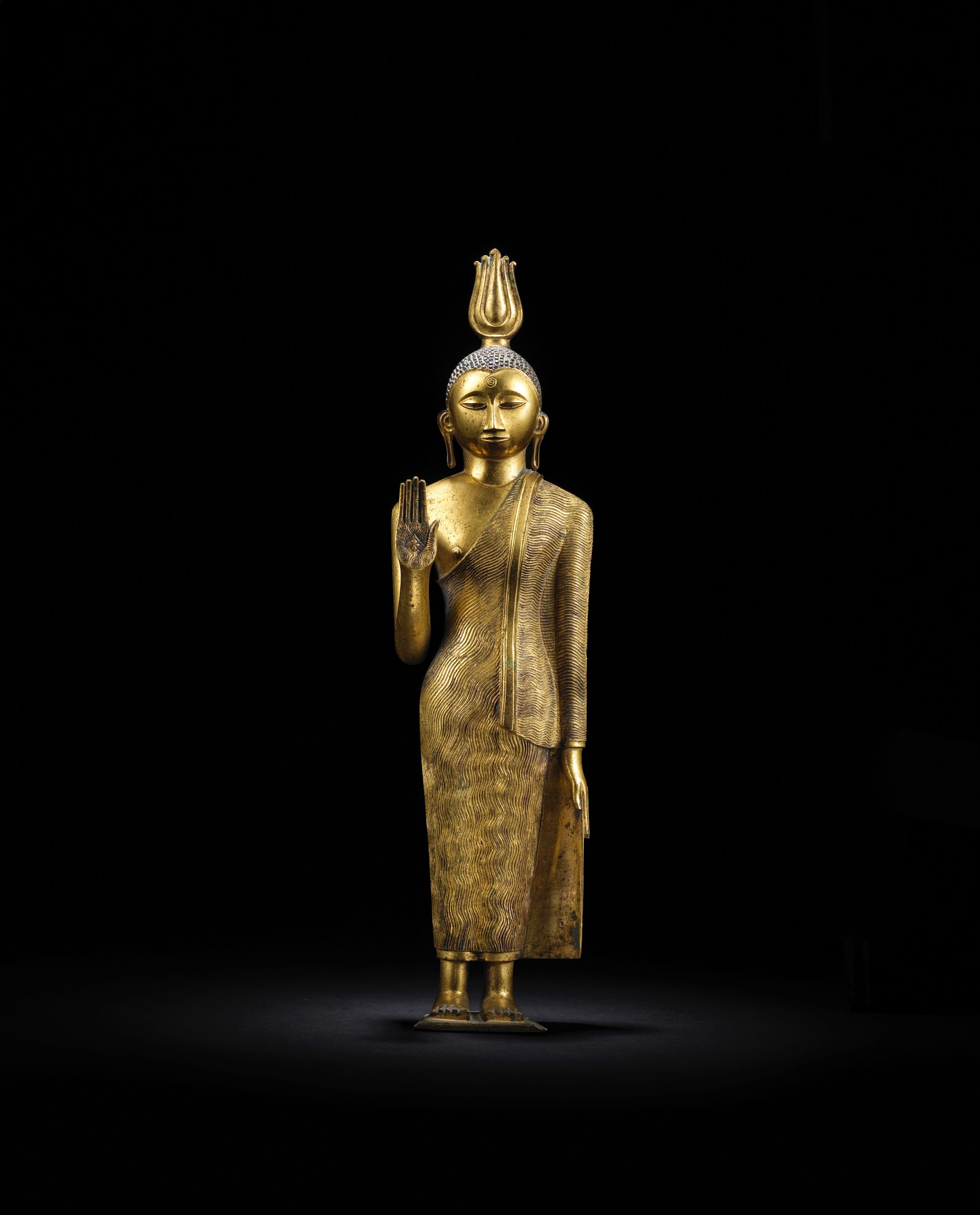Bonhams : A GILT COPPER ALLOY FIGURE OF STANDING BUDDHA Sri Lanka ...