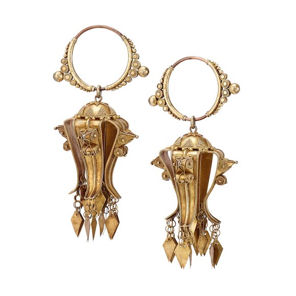 Bonhams : A PAIR OF LARGE KARO-BATAK GILT SILVER EARRINGS, KARABU ...