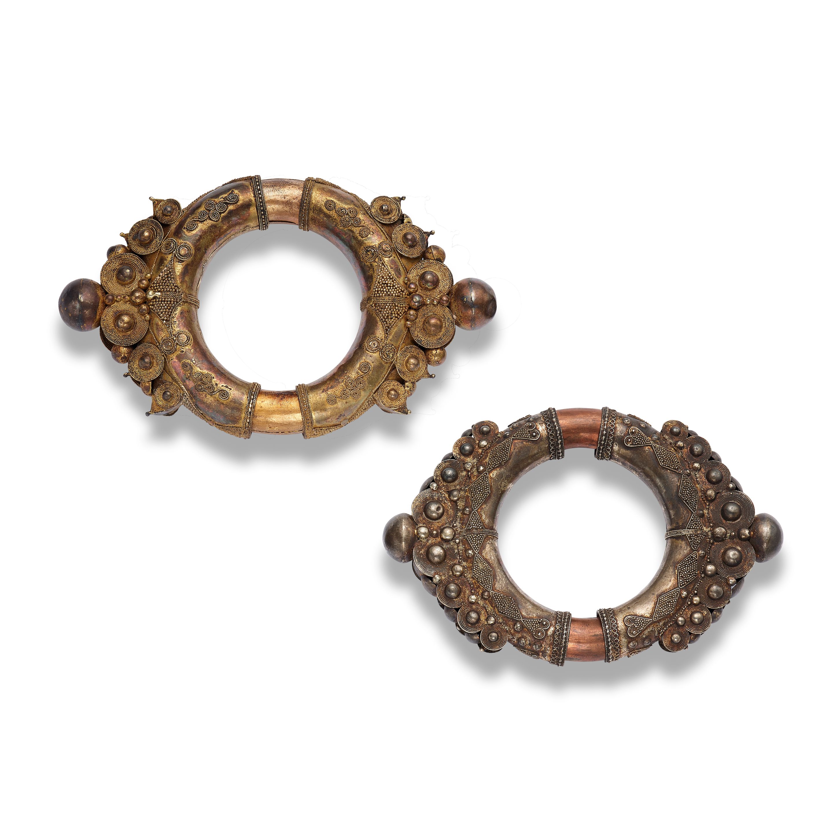 Bonhams : TWO KARO-BATAK GILT SILVER AND COPPER ARMBANDS, GELANG SARUNG ...