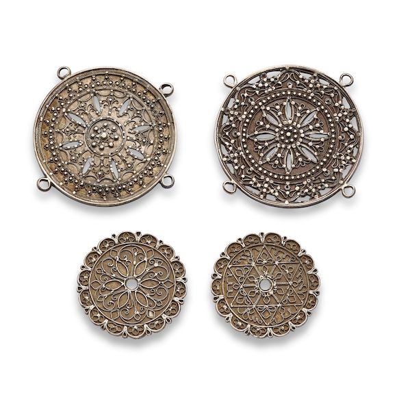 Bonhams : TWO PAIRS OF AUSPICIOUS DISCS, KUWARI BUGIS OR MAKASSAR ...