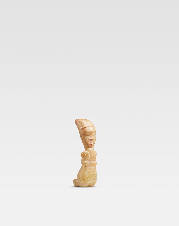 Bonhams : A rare calcified jade carving of a kneeling figure Late Shang ...