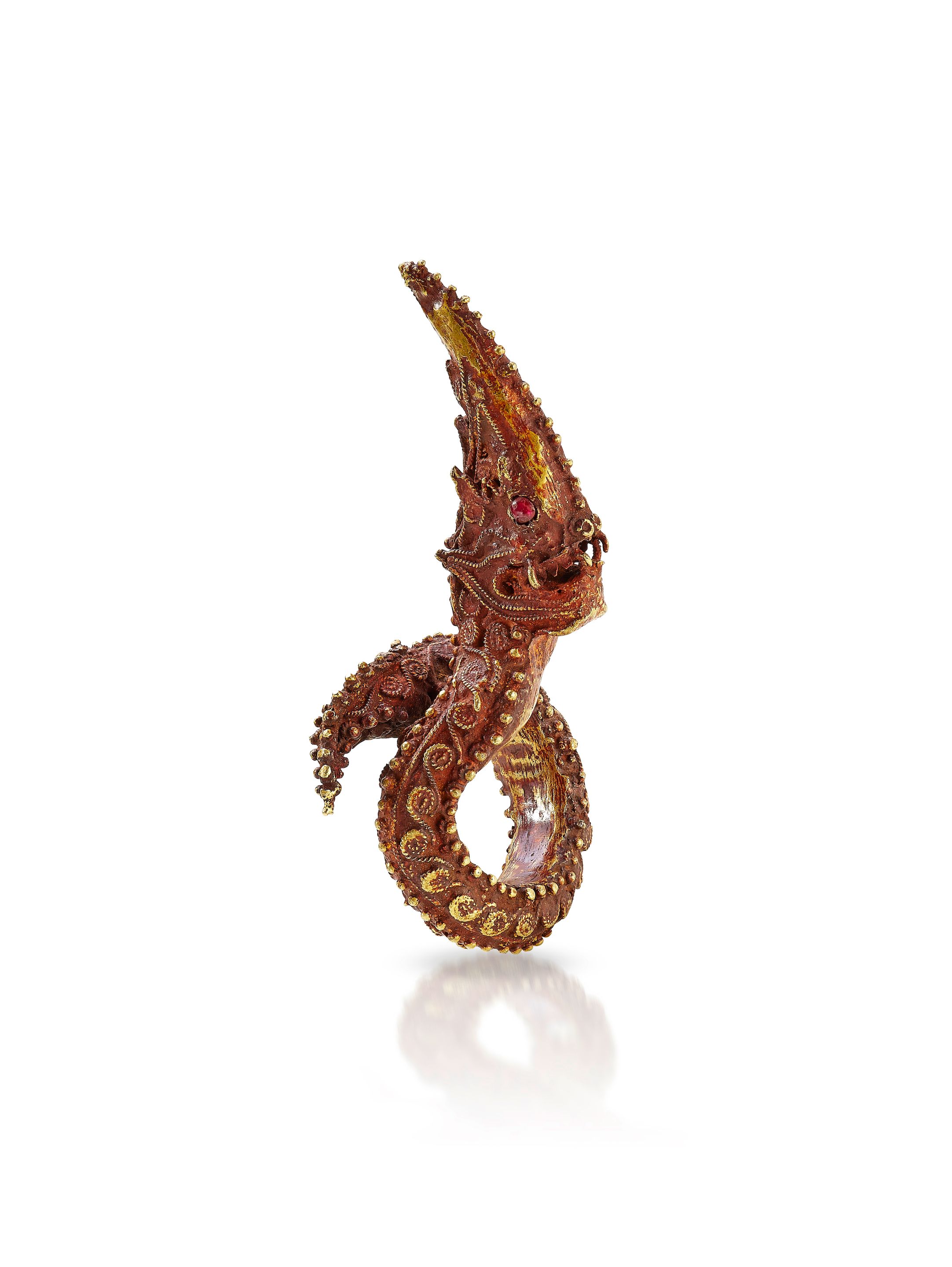 Bonhams : A GOLD NAG RING THAILAND