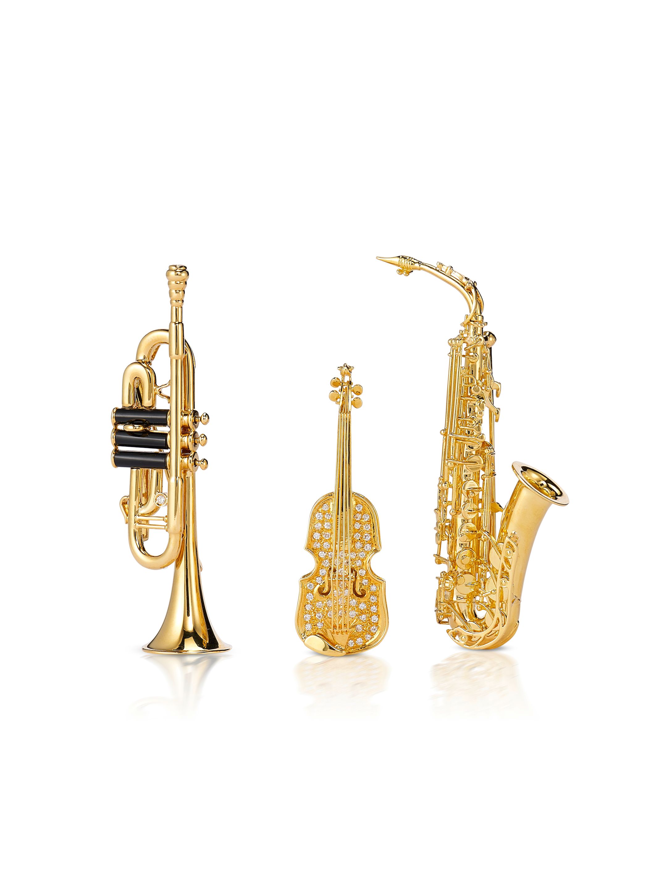 Bonhams : A GROUP OF 18K GOLD, ONYX AND DIAMOND MUSICAL INSTRUMENT BROOCHES