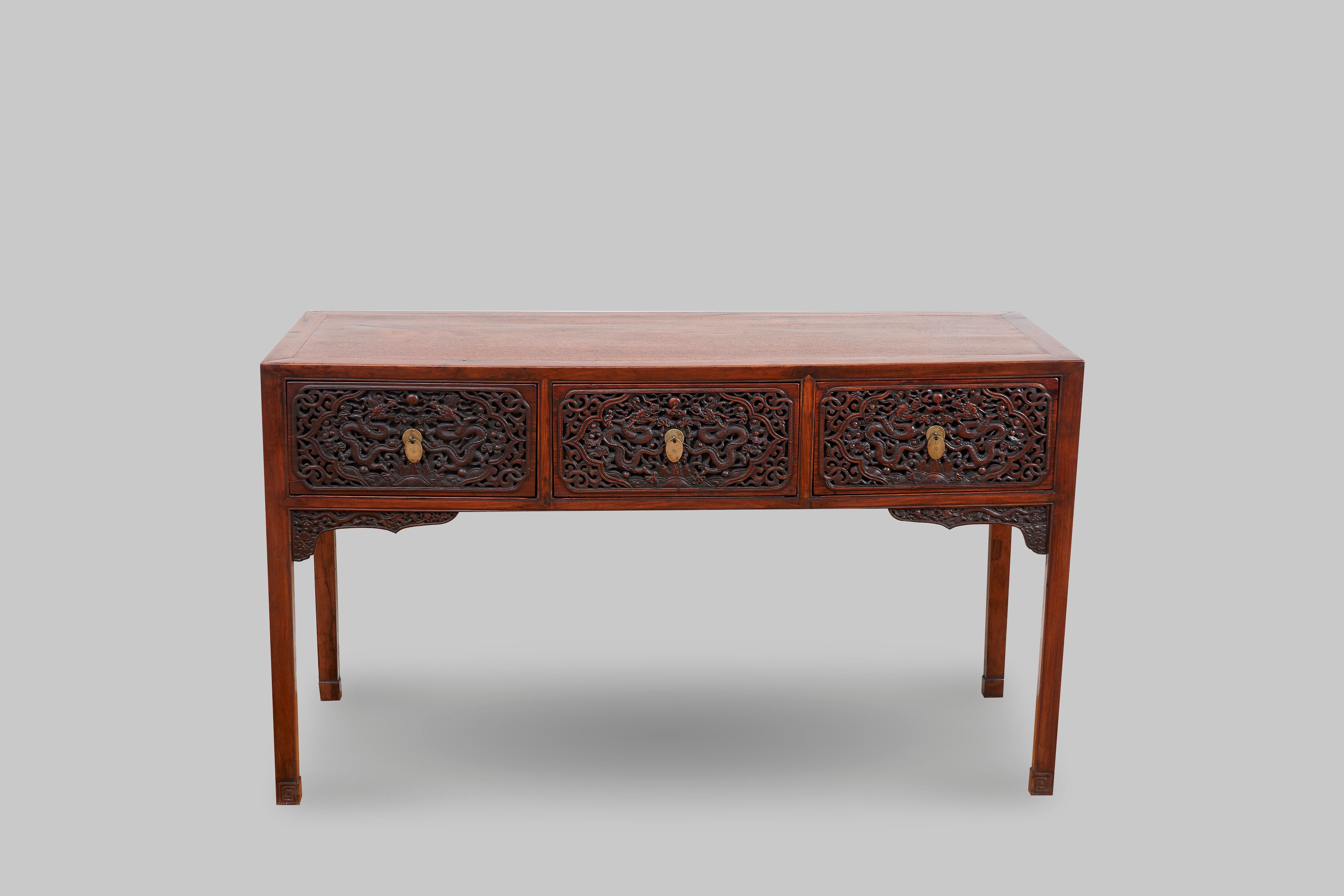 Bonhams : A huanghuali and hongmu three-drawer desk Qing dynasty