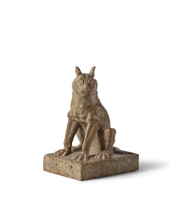 Bonhams : An amber-coloured stone seated lion Tang Dynasty or later