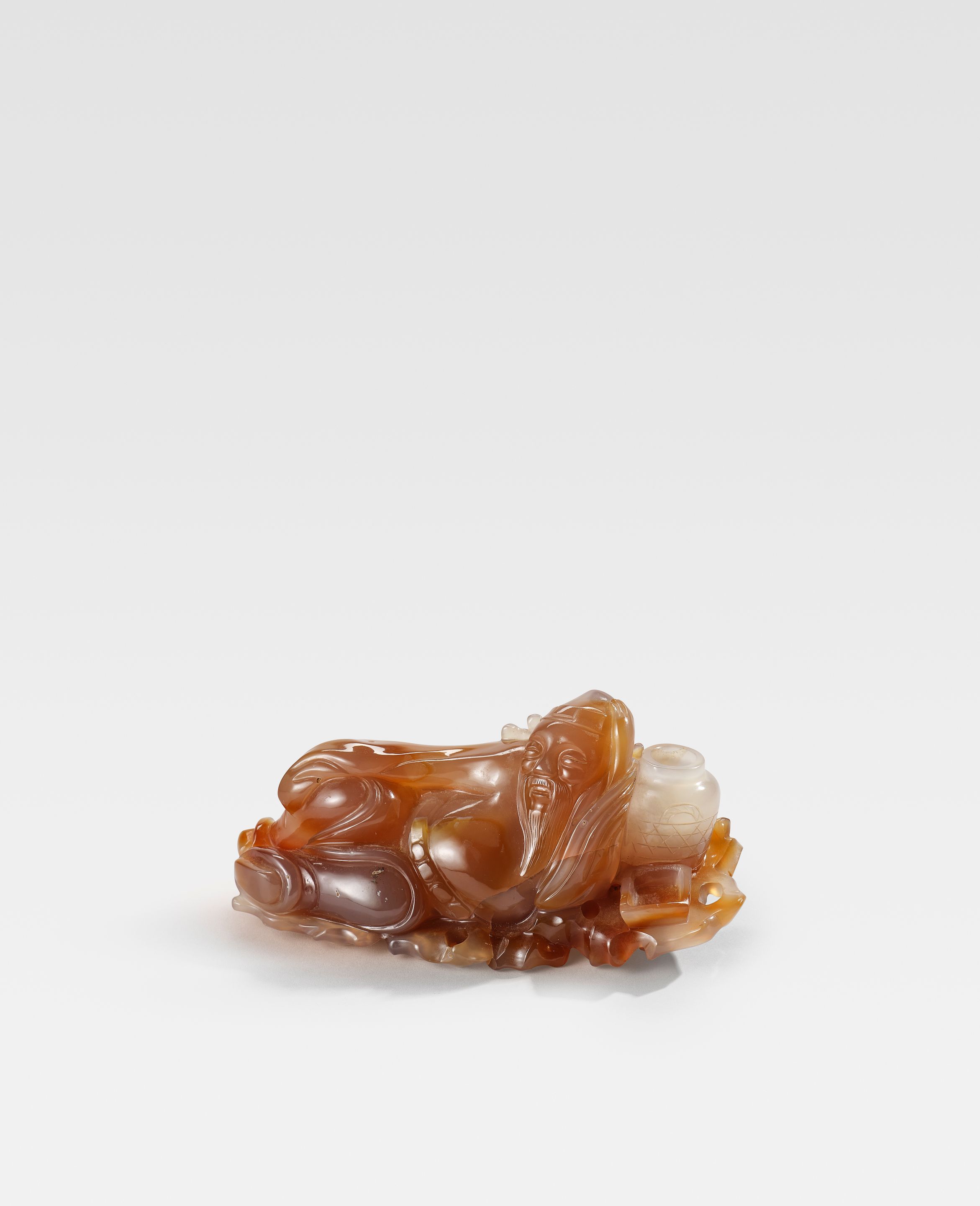 Bonhams : AN AGATE CARVED FIGURE OF 'DRUNK LI BAI' 17th century (2)