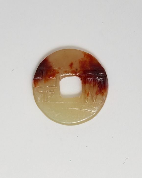 Bonhams : A rare small jade coin Possibly Han dynasty