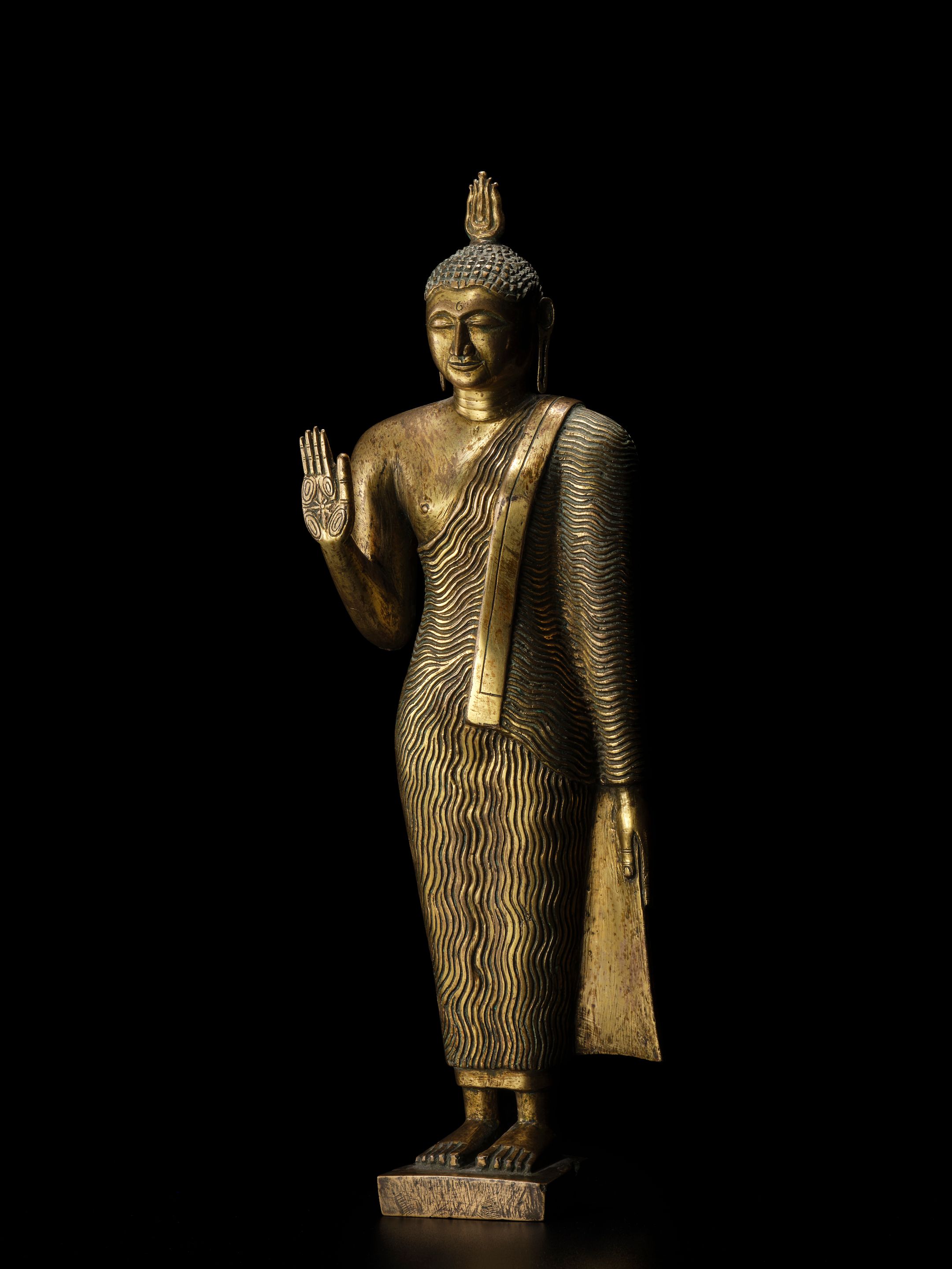 Bonhams : A GILT COPPER ALLOY FIGURE OF STANDING BUDDHA SRI LANKA ...
