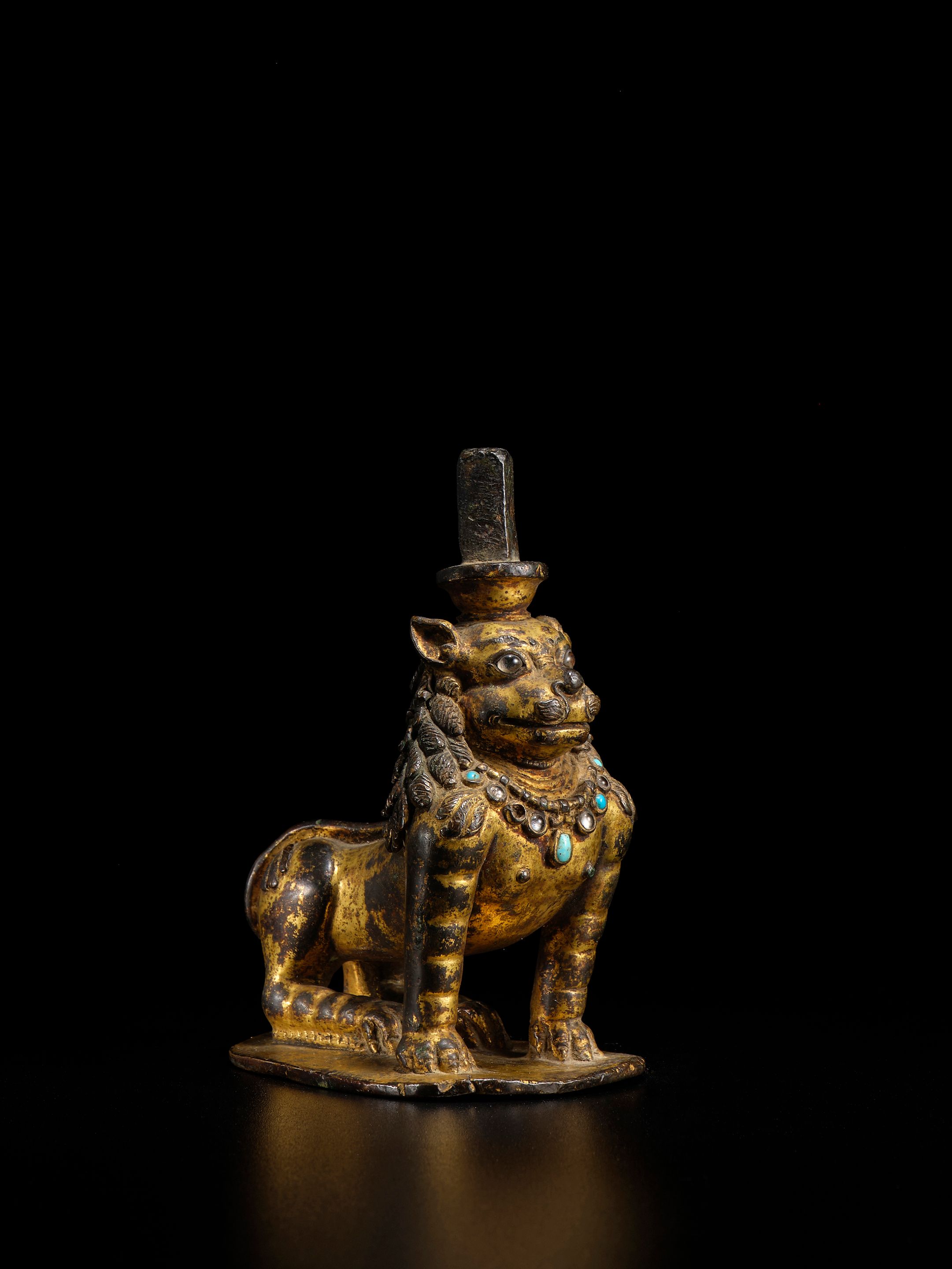 Bonhams : A GILT COPPER LION THRONE STRUT NEPAL, CIRCA 14TH CENTURY