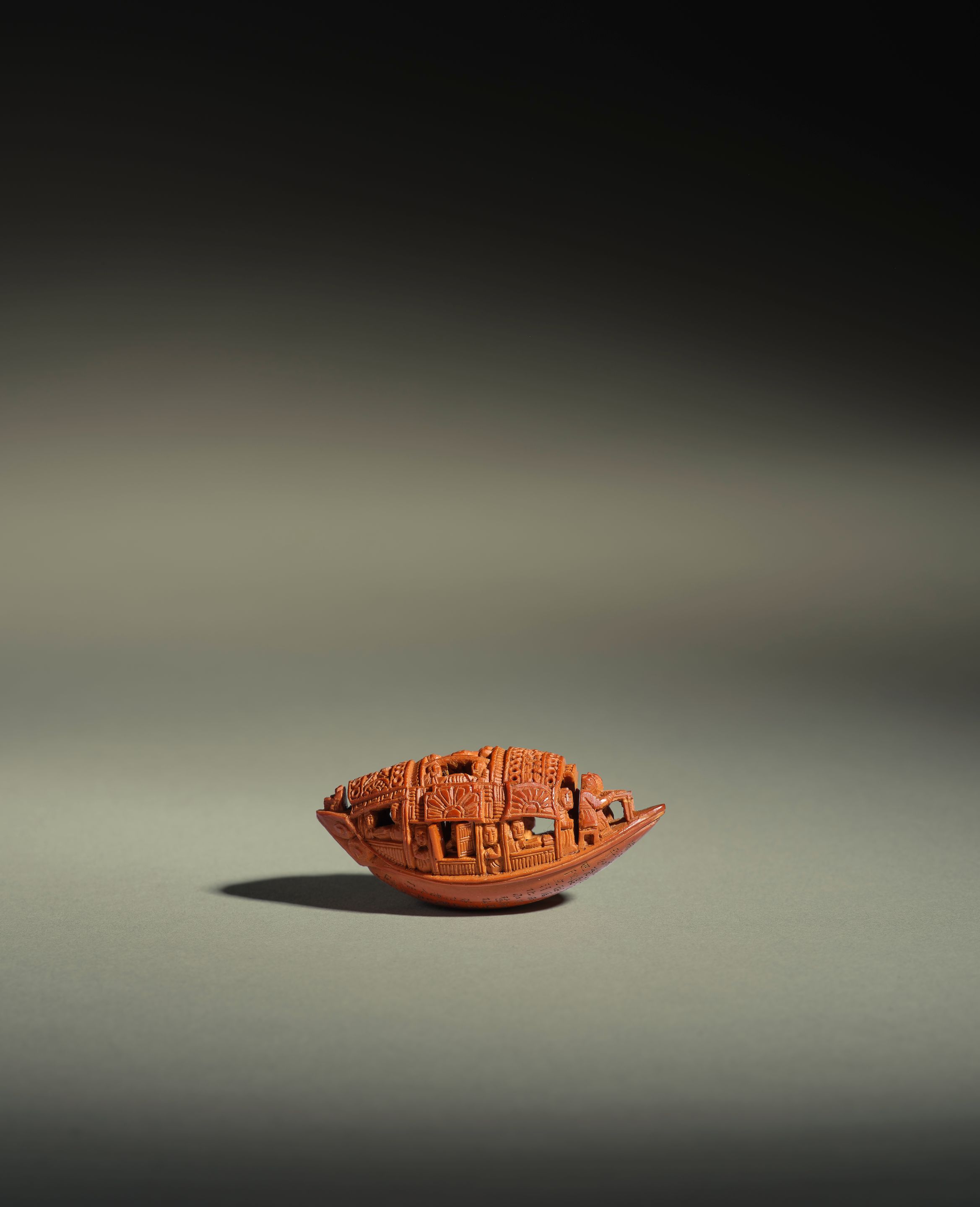 Bonhams : AN INSCRIBED RETICULATED MINIATURE OLIVE-STONE CARVING 19th ...