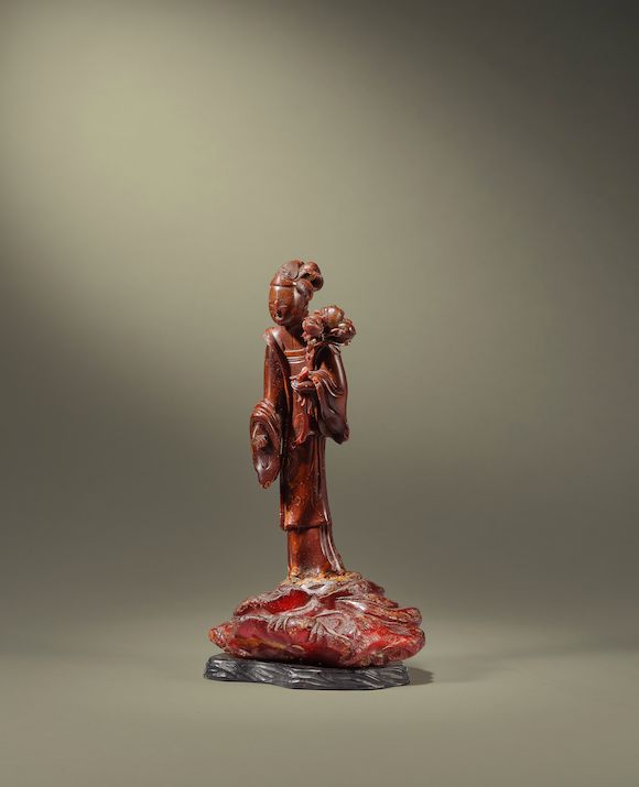 Bonhams : A VERY RARE CARVED AMBER FIGURE OF A STANDING LADY 18th/19th ...