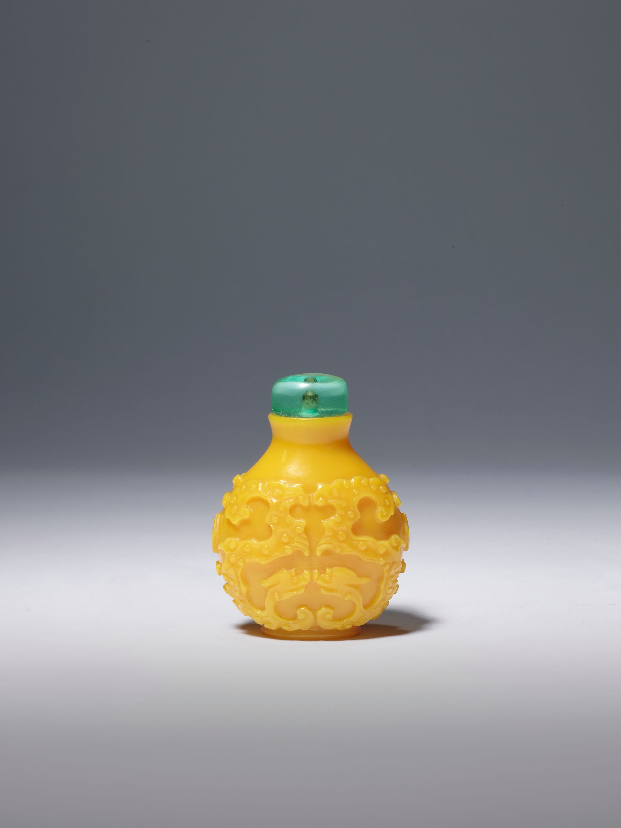 Bonhams : A FINELY CARVED IMPERIAL YELLOW GLASS 'CHILONG' SNUFF BOTTLE ...