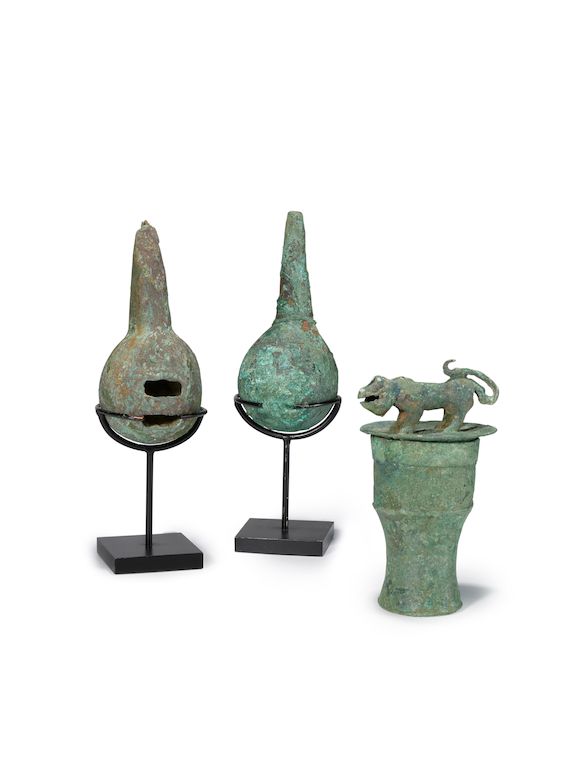 Bonhams : A BRONZE CUP WITH COVER AND TWO BRONZE MUSICAL INSTRUMENTS ...