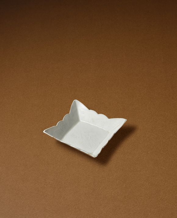 Bonhams : A SMALL MOULDED WHITE-GLAZED SQUARE FOLIATE DISH Liao Dynasty