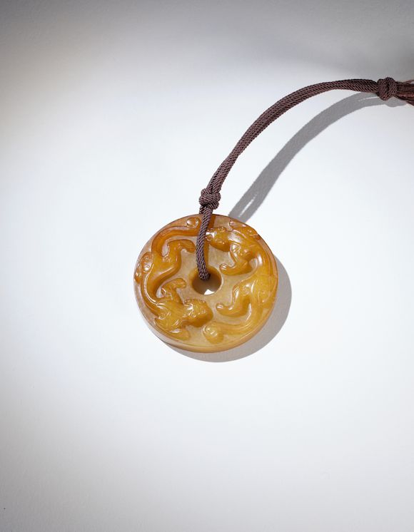 Bonhams : A YELLOW AND RUSSET JADE 'CHILONG' DISC, BI Song/Ming Dynasty