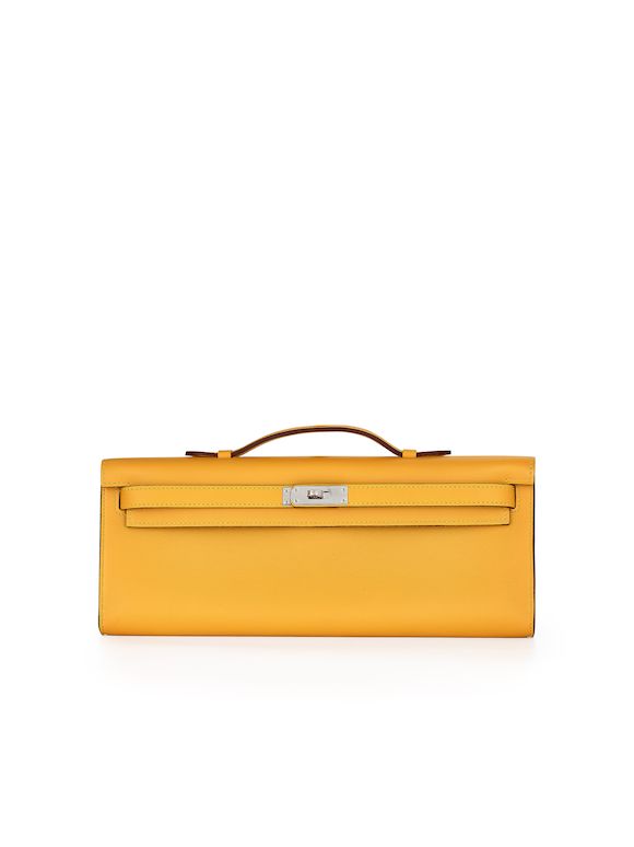 Bonhams : HERMÈS :JAUNE AMBRE SWIFT KELLY CUT CLUTCH BAG WITH PALLADIUM ...