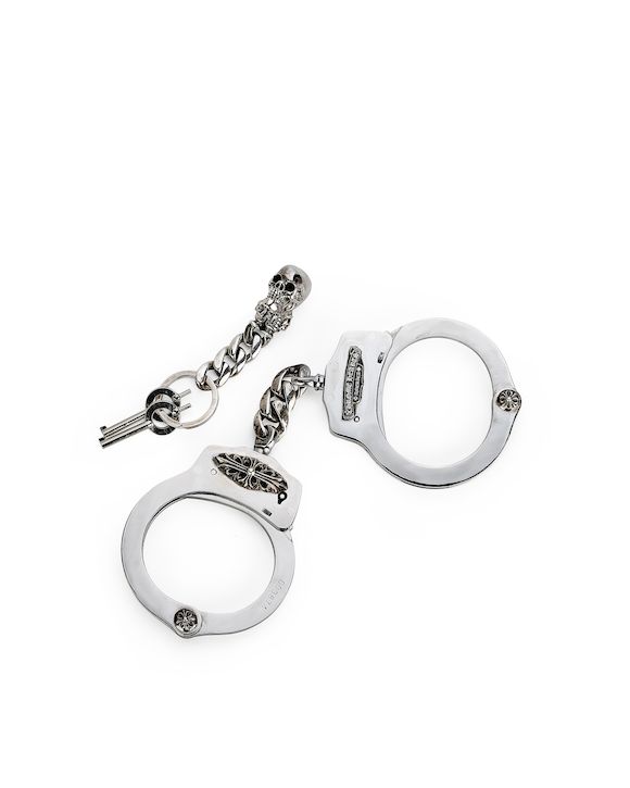 Bonhams : CHROME HEARTS: 925 STERLING SILVER HANDCUFFS WITH RAISED ...