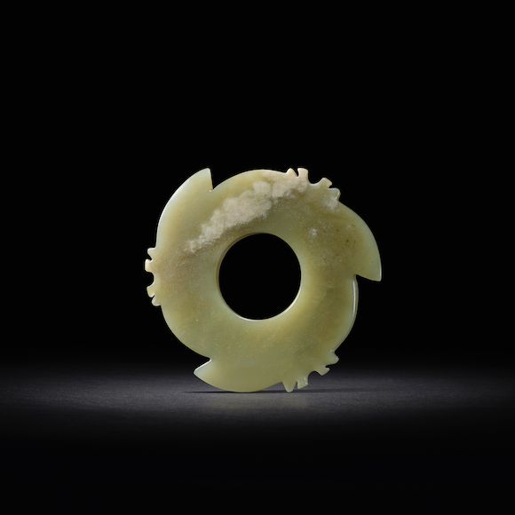 Bonhams : A PALE GREEN JADE NOTCHED DISC Late Neolithic Period/Shang ...