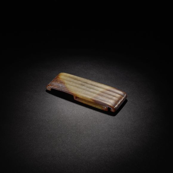 Bonhams : AN ARCHAIC JADE SWORD SLIDE Han Dynasty