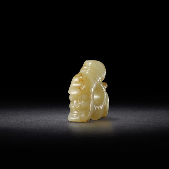 Bonhams : A JADE 'HUMANOID HEAD' ORNAMENT Western Zhou Dynasty