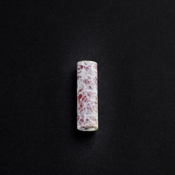 Bonhams : AN ALTERED RED JADE TUBULAR ORNAMENT Neolithic Period
