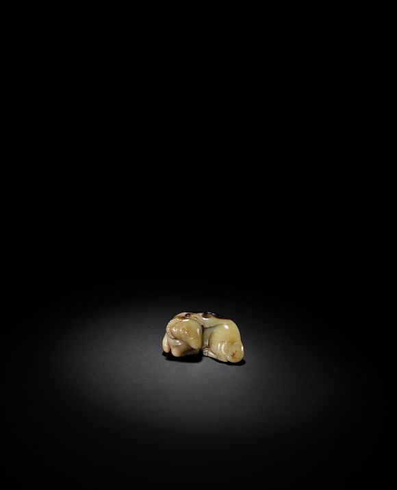 Bonhams : A GREEN AND RUSSET JADE CARVING OF A RAM Song Dynasty or earlier