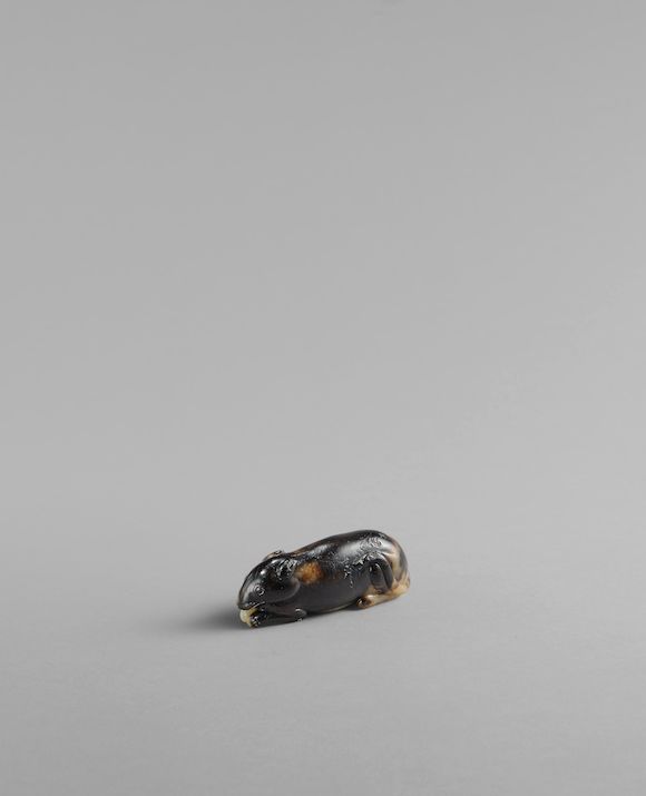Bonhams : A PALE GREEN AND BLACK JADE CARVING OF A MONGOOSE Song/Ming ...