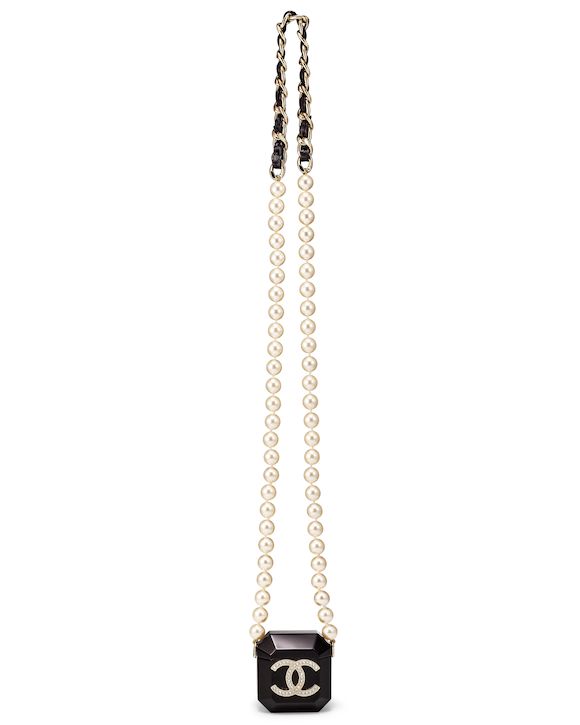 Bonhams : CHANEL BLACK ACRYLIC AND WHITE FAUX PEARL CHAINED AIRPOD CASE