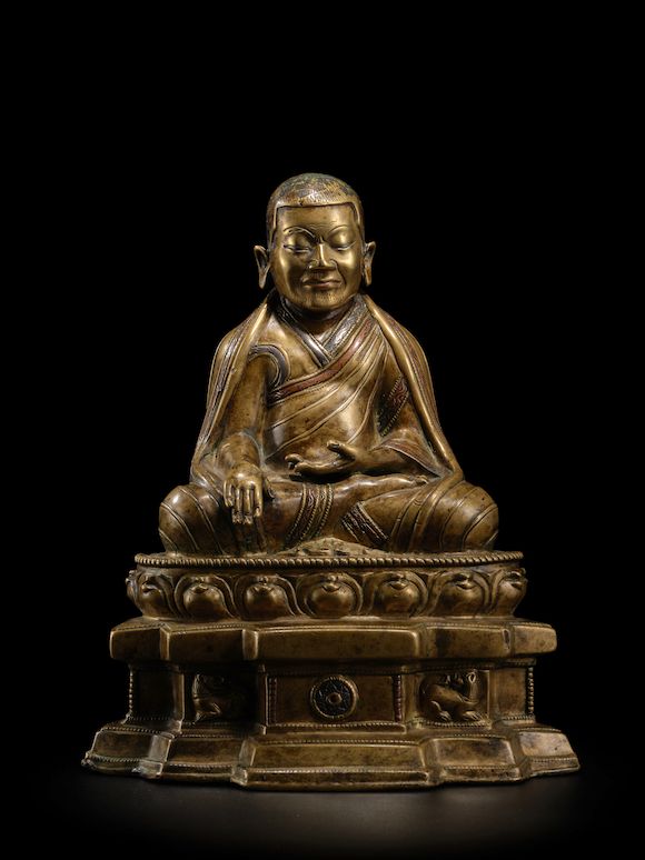 Bonhams : A SILVER AND COPPER INLAID BRASS FIGURE OF AN ENTHRONED KAGYU ...