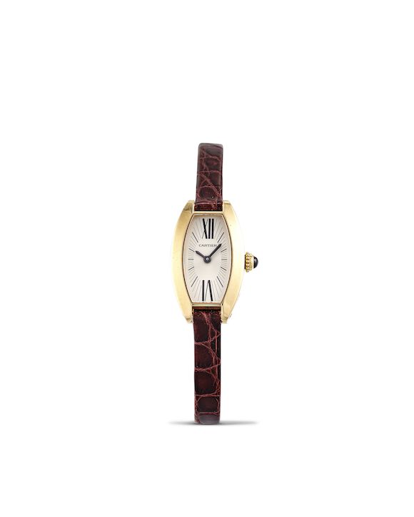 Bonhams : CARTIER | MINI TONNEAU, REF.2592, A YELLOW GOLD WRISTWATCH ...