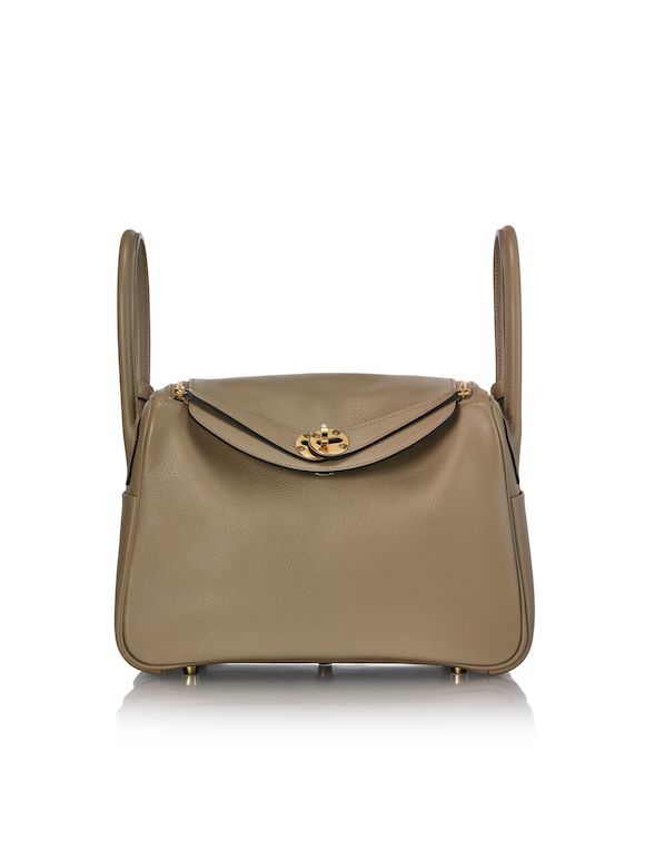 Bonhams : HERMÈS: BEIGE MARFA EVERCOLOR LINDY 26 WITH GOLD HARDWARE ...