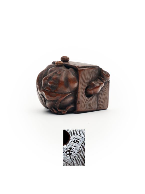 Bonhams : A WOOD NETSUKE OF DEMON WITH HIS HEAD IN A BOX Signed ...
